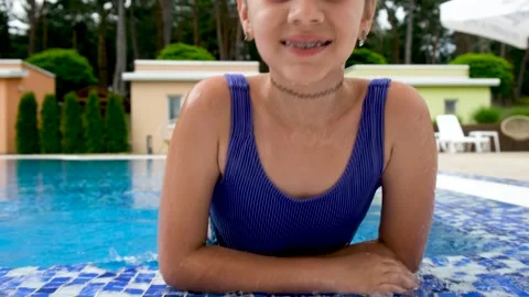 Young girl in the swimming pool, close-u... | Stock Video | Pond5