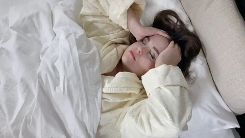 Young girl tossing and turning in bed, t... | Stock Video | Pond5