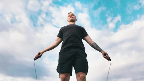 Young guy jumping rope on stadium | Stock Video | Pond5