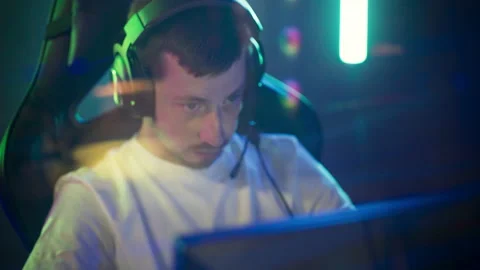 A young guy is playing the newest comput... | Stock Video | Pond5