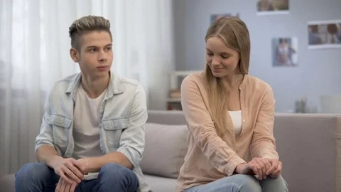 Young guy sitting closer to girlfriend o... | Stock Video | Pond5