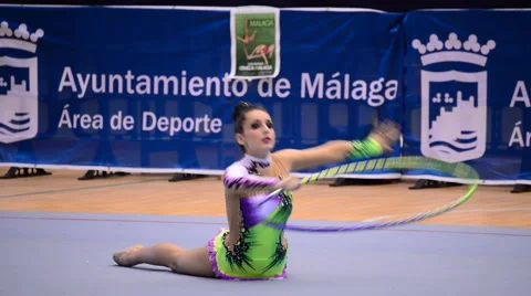 Young gymnast with ring on rhythmic gymn... | Stock Video | Pond5