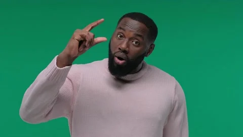 Young handsome black man show a little b... | Stock Video | Pond5