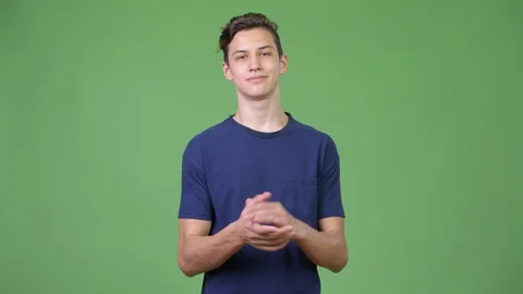 Young handsome teenage boy clapping hand... | Stock Video | Pond5