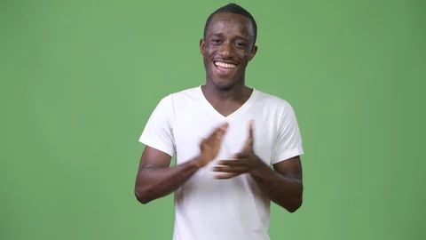 Young happy African man clapping hands a... | Stock Video | Pond5
