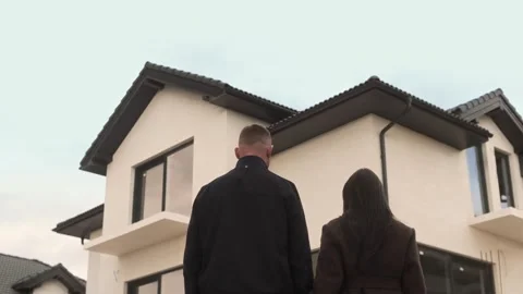 Young happy family stand looking at a la... | Stock Video | Pond5