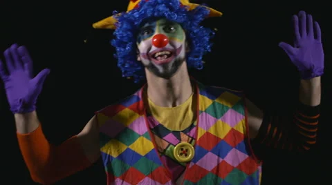 Young hilarious clown making funny faces | Stock Video | Pond5