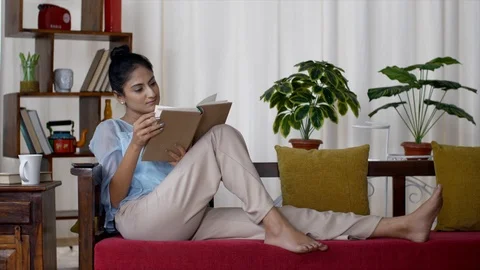 Young Indian beautiful girl sitting on a... | Stock Video | Pond5