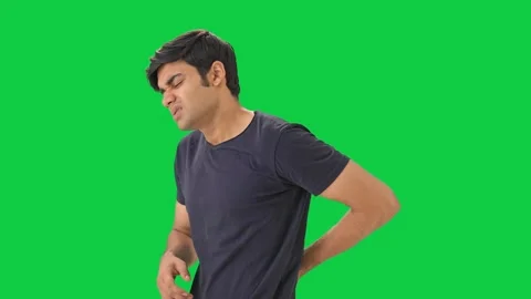 Young Indian boy having back pain Green ... | Stock Video | Pond5