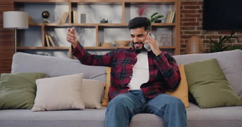 Young indian guy speaking using mobile p... | Stock Video | Pond5
