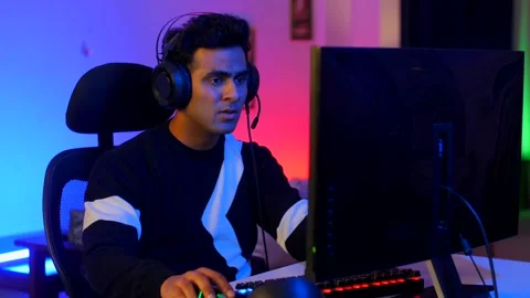 A young Indian streamer stressed while p... | Stock Video | Pond5