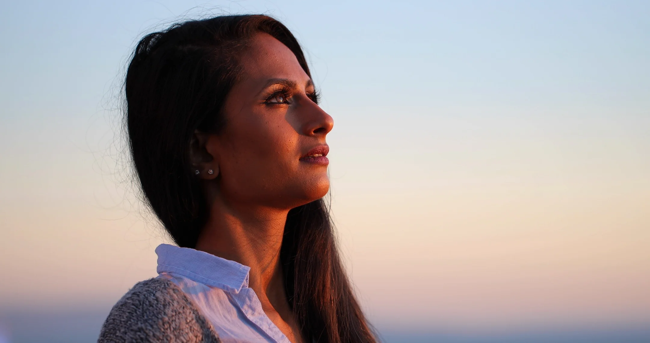 Woman Looking Up At Sky Profile