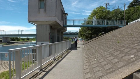 Young JAPANESE MAN RUNNING at the rivers... | Stock Video | Pond5