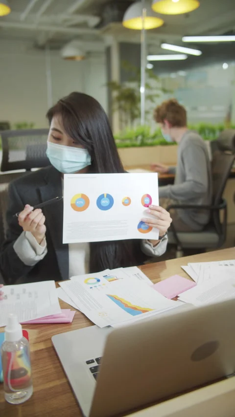 A young lady is showing someone diagrams... | Stock Video | Pond5