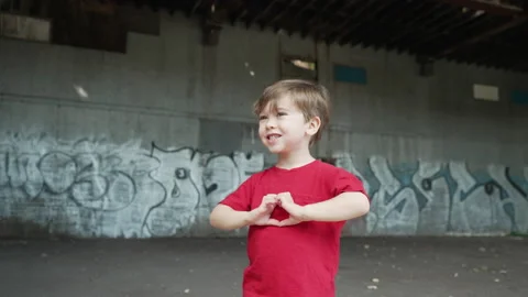 A young little boy is having fun and mak... | Stock Video | Pond5