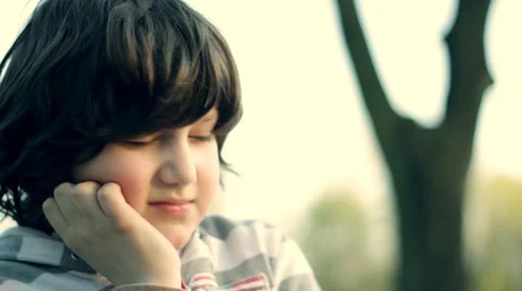 Young lonely sad boy face portrait, outd... | Stock Video | Pond5