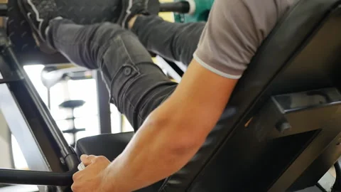 a young male bodybuilder performs a leg ... | Stock Video | Pond5