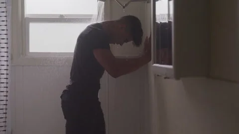 Young Man Angry In Shower | Stock Video | Pond5
