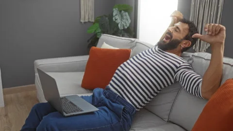 Young man with beard yawning and stretch... | Stock Video | Pond5