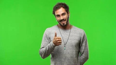 young man on chroma green screen smiling... | Stock Video | Pond5