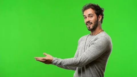 young man on chroma green screen holding... | Stock Video | Pond5