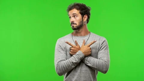 young man on chroma green screen decide ... | Stock Video | Pond5