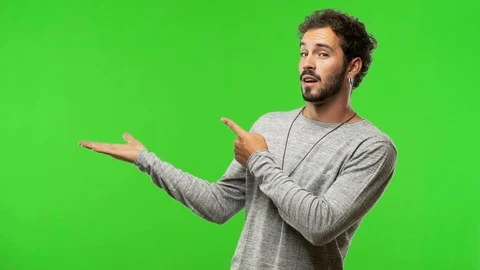 young man on chroma green screen holding... | Stock Video | Pond5