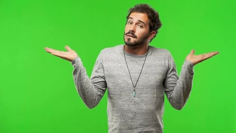 young man on chroma green screen confuse... | Stock Video | Pond5