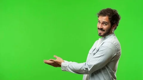young man on chroma green screen holding... | Stock Video | Pond5