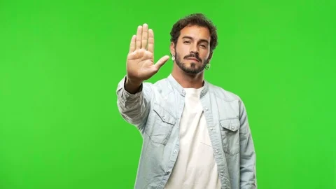 young man on chroma green screen putting... | Stock Video | Pond5