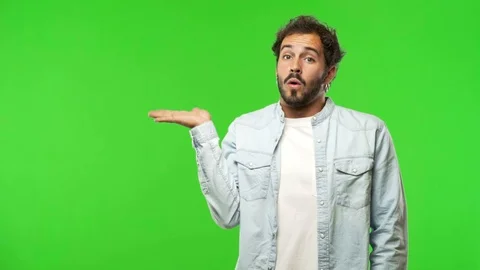 young man on chroma green screen holding... | Stock Video | Pond5