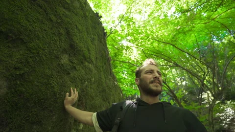The young man is crying in the forest. | Stock Video | Pond5