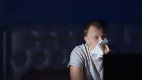 Young man crying at night watching TV an... | Stock Video | Pond5