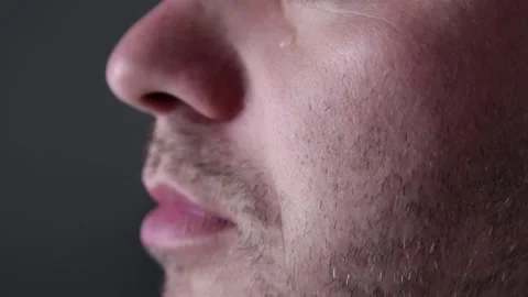 Young man crying with a tear running dow... | Stock Video | Pond5