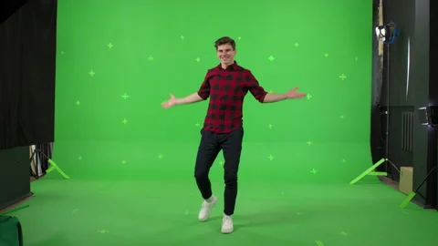 young man dancing on green screen backgr... | Stock Video | Pond5