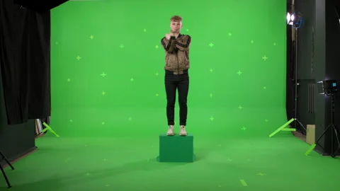 young man dancing on green screen backgr... | Stock Video | Pond5