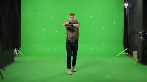 young man dancing on green screen backgr... | Stock Video | Pond5
