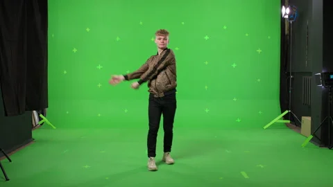 young man dancing on green screen backgr... | Stock Video | Pond5