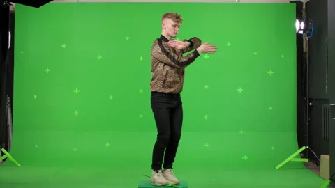 young man dancing on green screen backgr... | Stock Video | Pond5