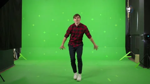 young man dancing on green screen backgr... | Stock Video | Pond5
