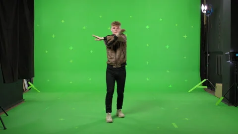 young man dancing on green screen backgr... | Stock Video | Pond5