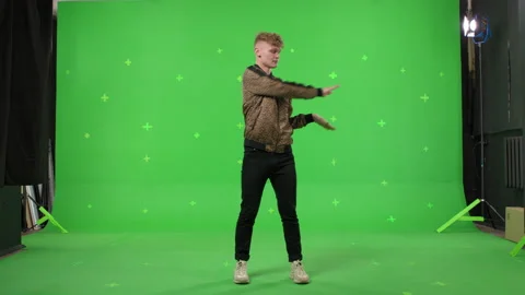 young man dancing on green screen backgr... | Stock Video | Pond5