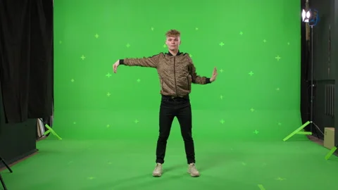young man dancing on green screen backgr... | Stock Video | Pond5