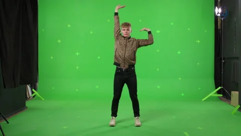 young man dancing on green screen backgr... | Stock Video | Pond5