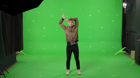 young man dancing on green screen backgr... | Stock Video | Pond5