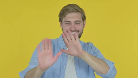 Young Man Dancing in Joy on Yellow Backg... | Stock Video | Pond5