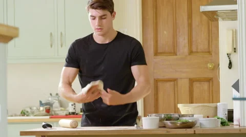 Young man decides to make home made Pizz... | Stock Video | Pond5