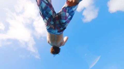 Young man does backflip and lands on bac... | Stock Video | Pond5