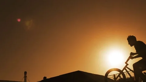 Young man doing ramp jump stunt on bmx b... | Stock Video | Pond5