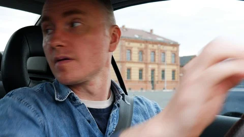 A young man driver moves in reverse. Clo... | Stock Video | Pond5